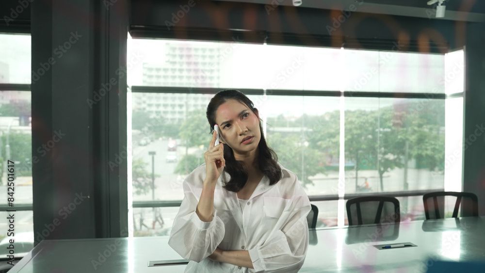 Beautiful female leader thinking about start up project in front of ...