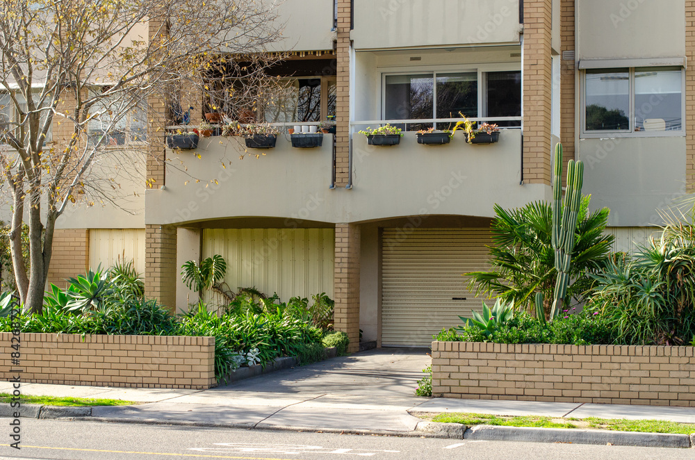 Exterior of a residential apartment building with a beige facade ...