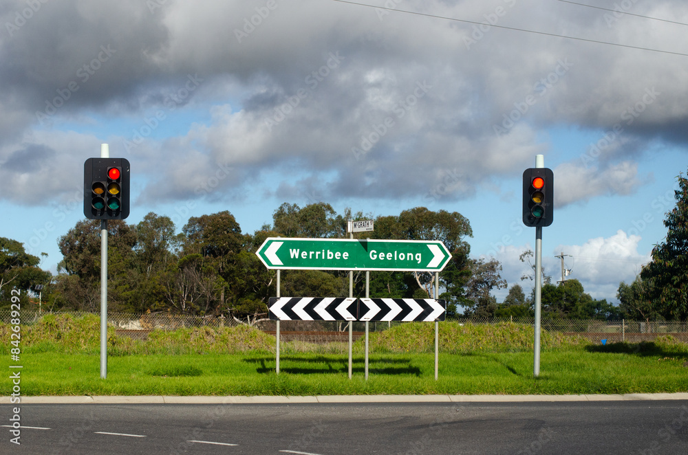 A road direction sign points in opposite directions, with Werribee to ...