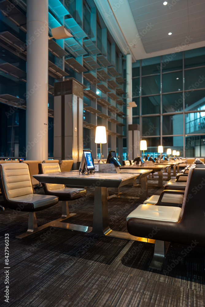 airport waiting room with digital tablets and lounge, advanced business ...