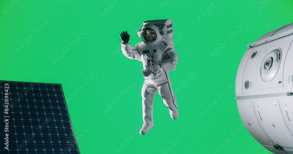Portrait of a Young Male Astronaut Posing in a Space Suit on an ...