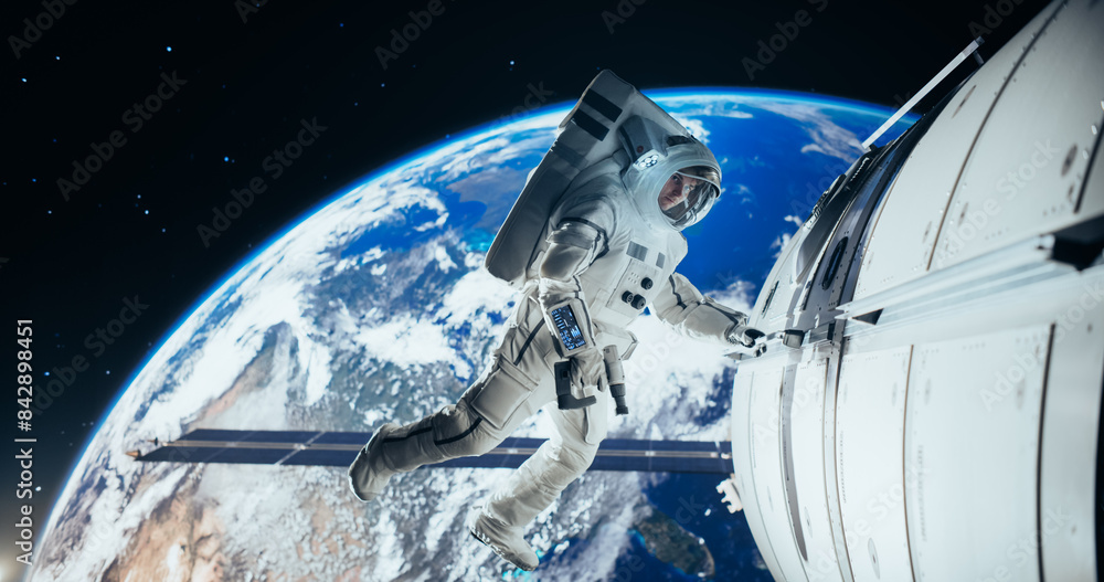 Astronaut on an Extravehicular Mission in Outer Space Far From Planet ...