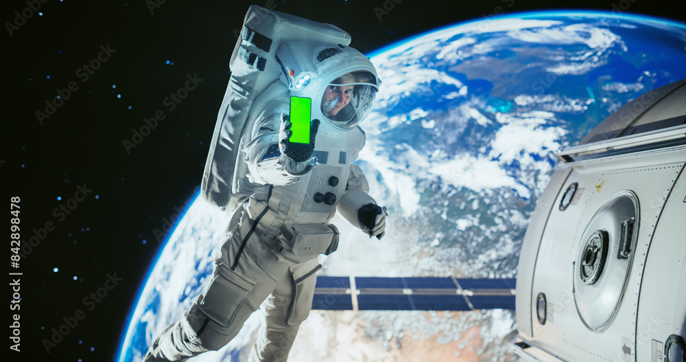 Young Astronaut Floating in Space in Zero Gravity. Spaceman Showing a ...