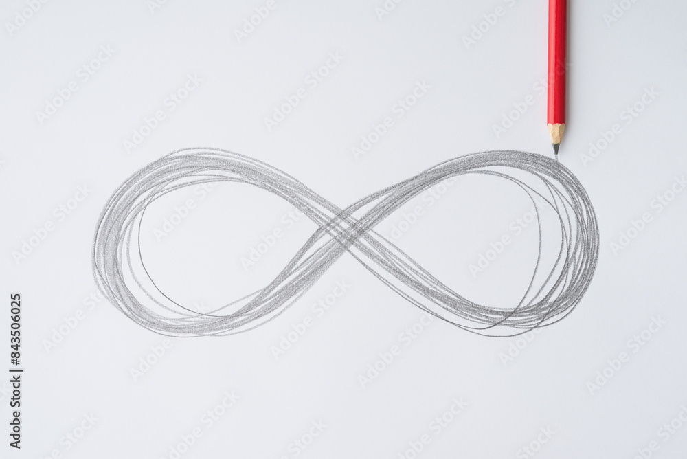 Flat lay red pencil hand drawing infinity symbol on white paper ...