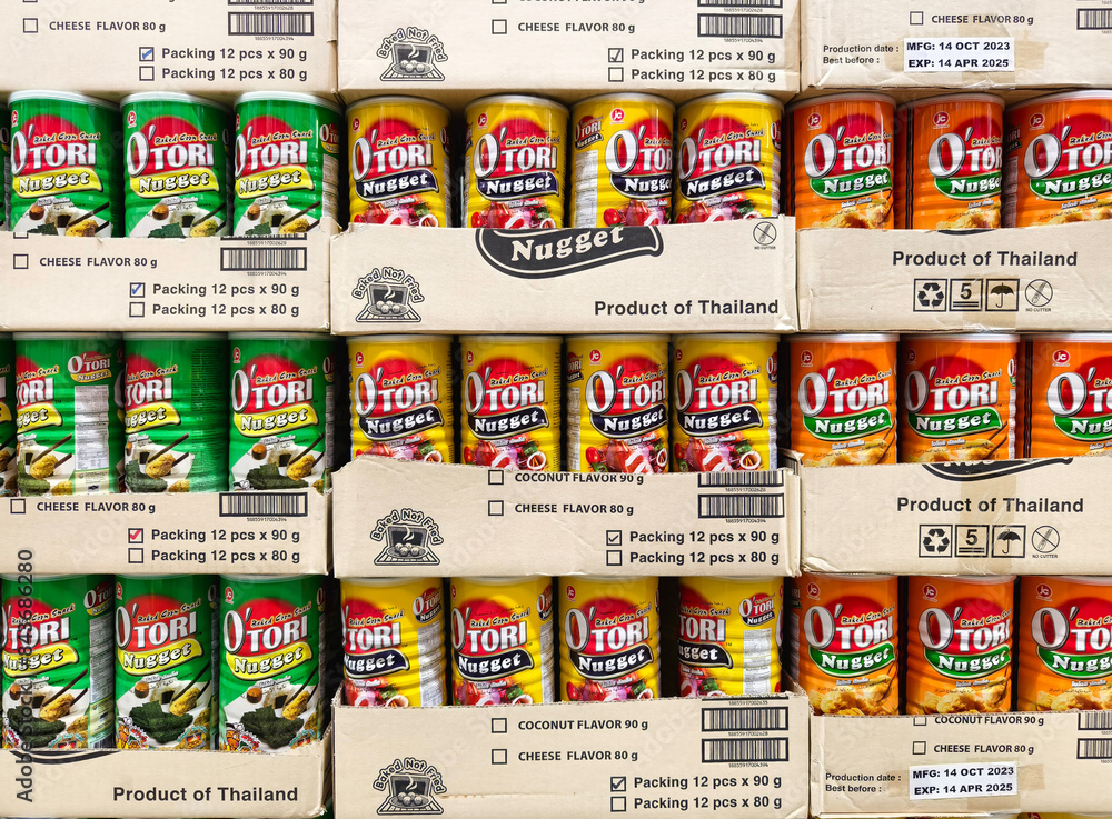 Assorted O'Tori Nugget baked corn snack canned products neatly stacked ...