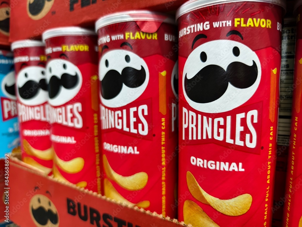 Pringles original flavor cans on supermarket shelf Stock Photo | Adobe ...