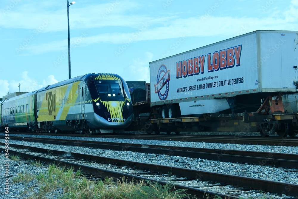 Hobby Lobby highway trailer on an TTX intermodal rail car on siding ...