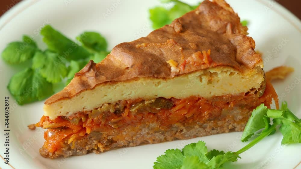 Camera Zoom Slice of Classic English casserole with meat and potatoes ...