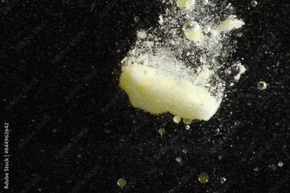 Science experiment of medicine capsules dissolve in a mixture of water ...