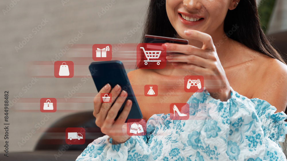 Elegant customer wearing blue dress controlling device choosing online ...