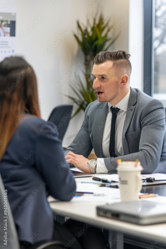 Professional Photography of a sales manager providing coaching and ...