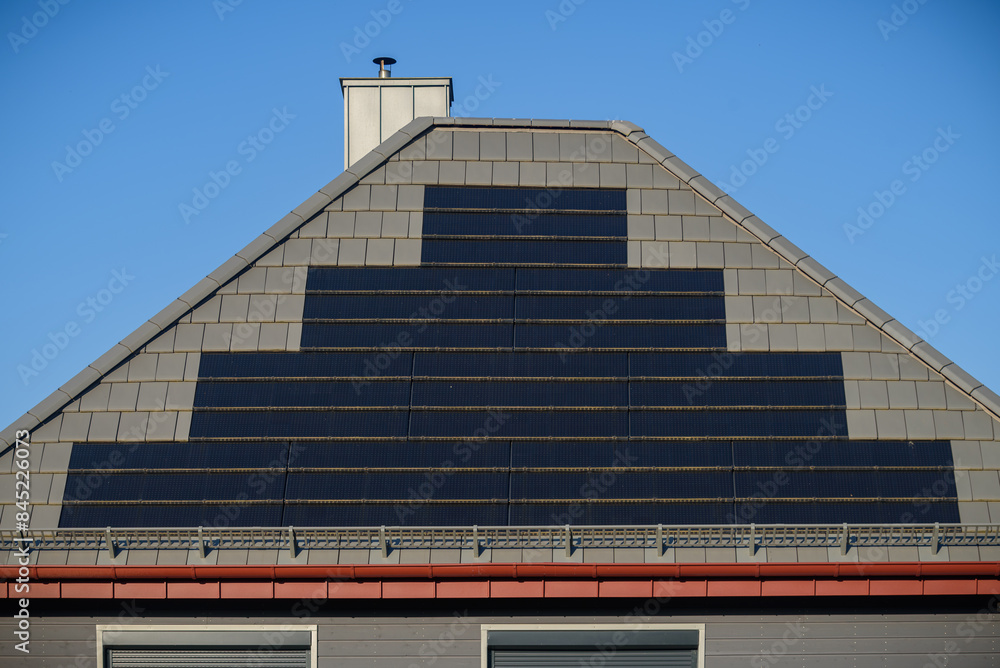 High-tech solar roof tiles on roof as solar power plant. Solar shingles ...