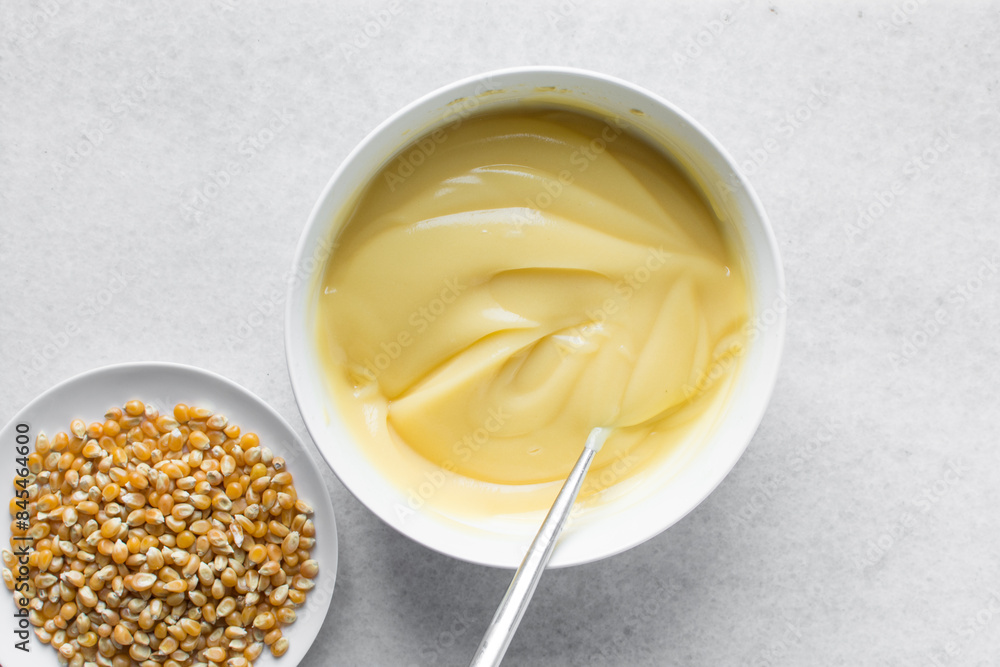 Overhead view of nigerian akamu in a white bowl, pap akamu or ogi in a ...