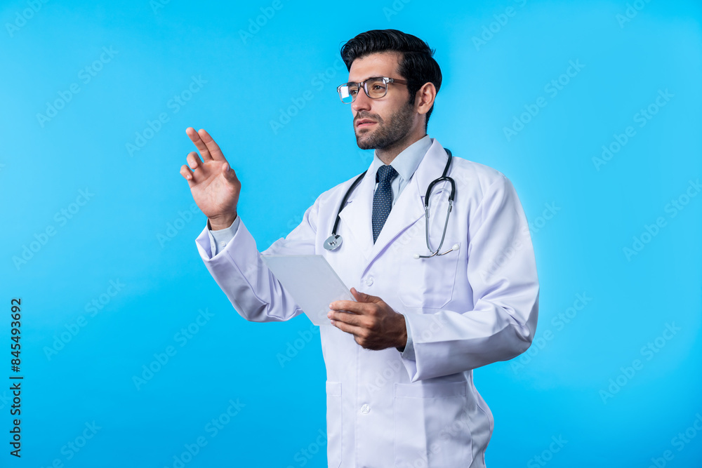Caucasian smart doctor pointing finger while standing at blue ...
