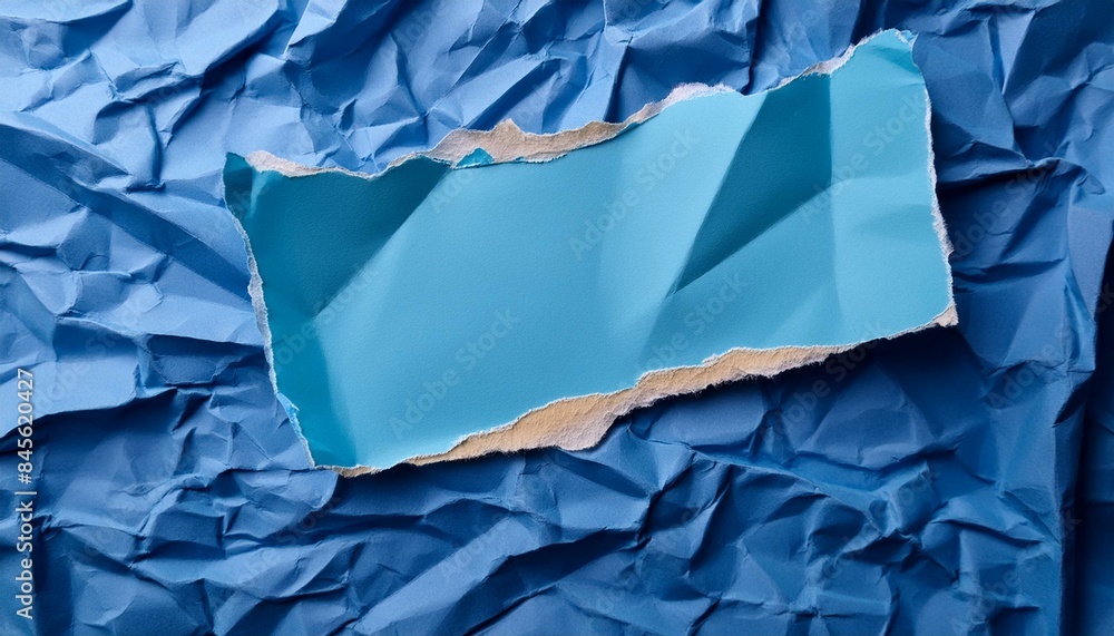 Blank blue crumpled torn paper piece on wrinkled blue paper background ...