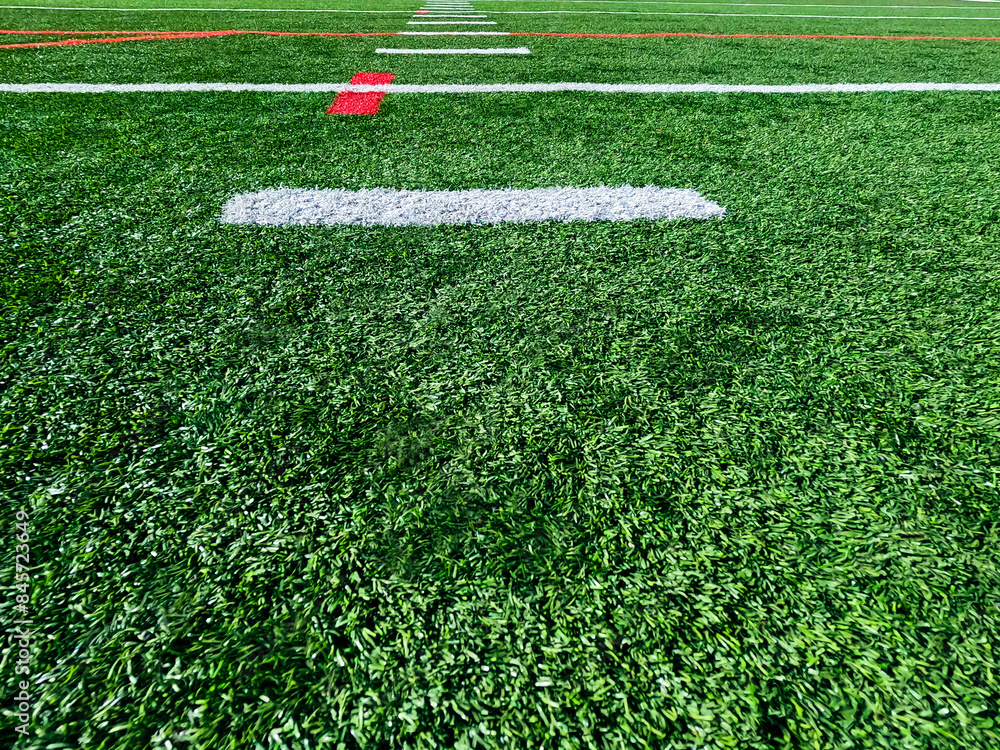 Sports Field Turf with Red and White Marker Lines. Bright green turf ...