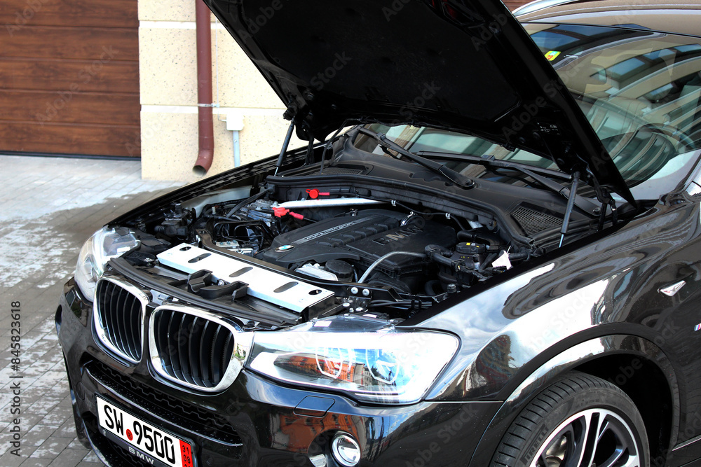 Vinnytsia, Ukraine; May 04, 2024. Black BMW X4 M40i open hood. German ...