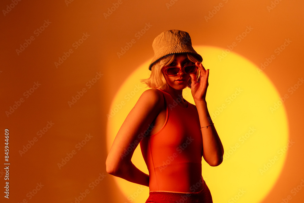 Stylish female model with light natural makeup wearing trendy ...