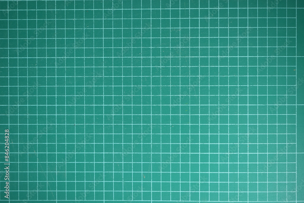 green cutting mat board background with line and scale measure guide ...