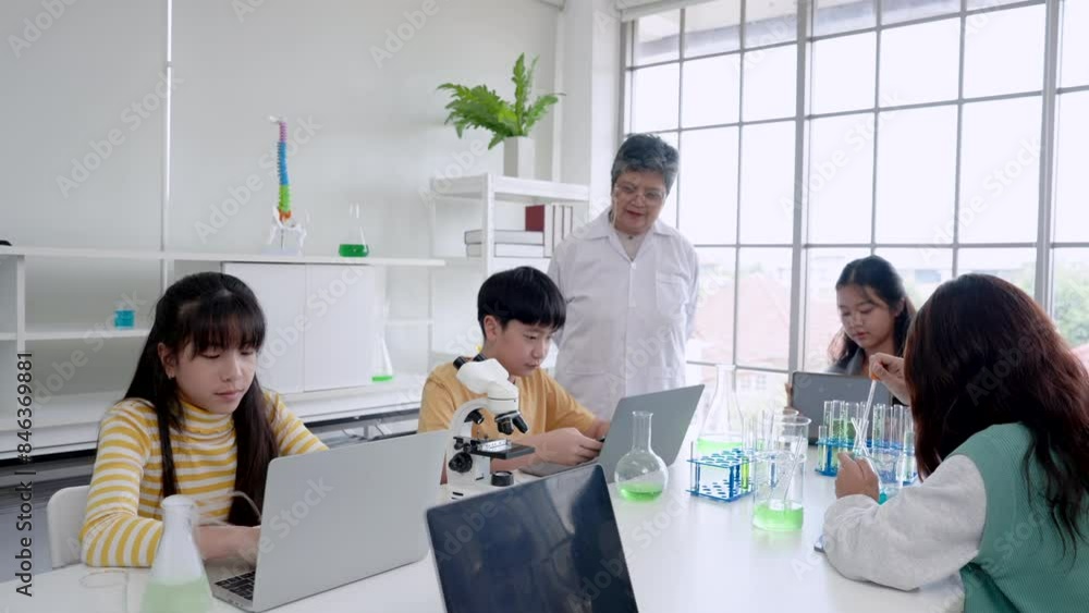 science teacher giving students Learn about microorganisms in test ...