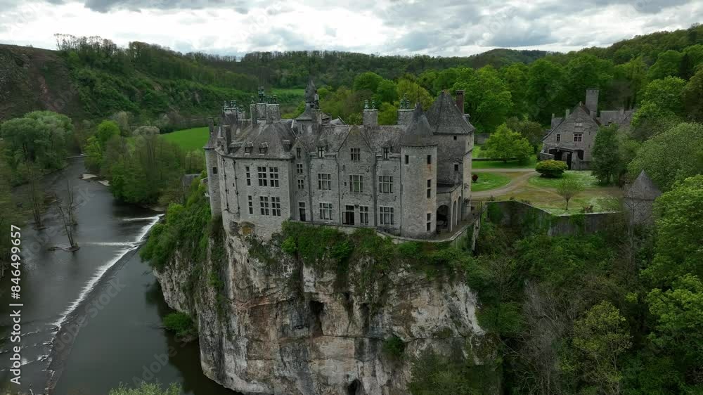 Drone footage of Walzin Castle on a hill over the river Lesse in Dinant ...