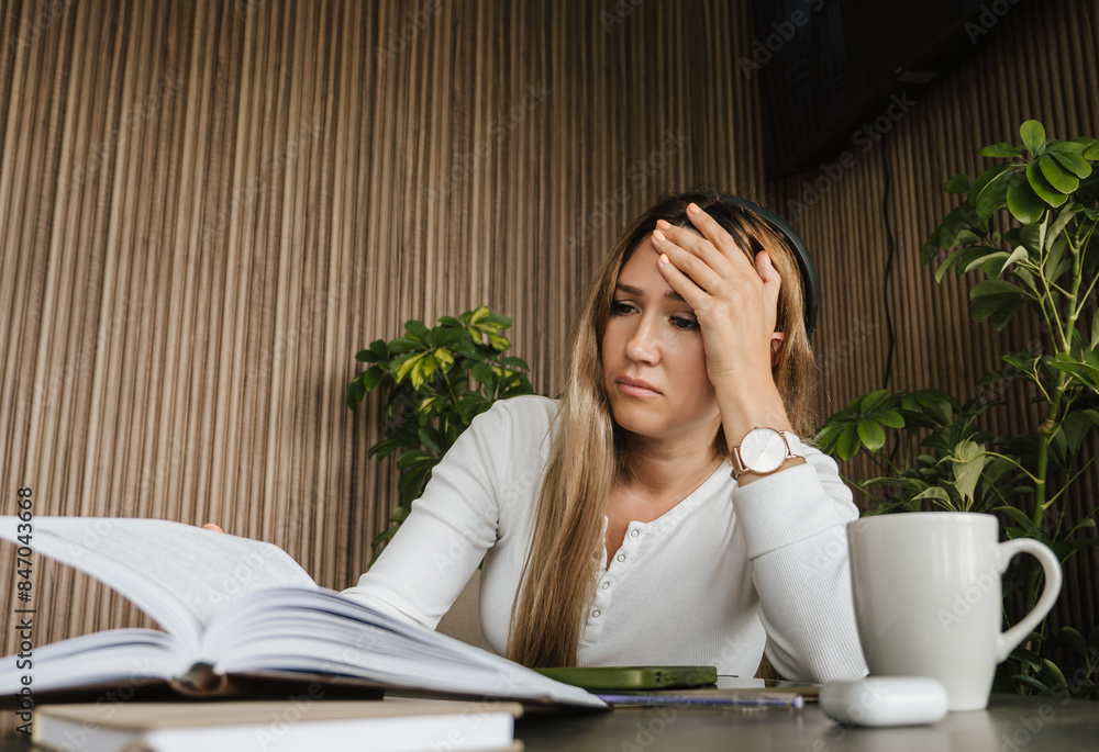 Woman struggling with reading, signs of dyslexia, holding head in ...
