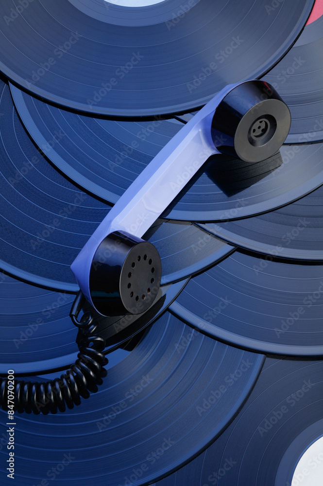 Vinyl record background with headset rotary phone. Collection of vinyl ...