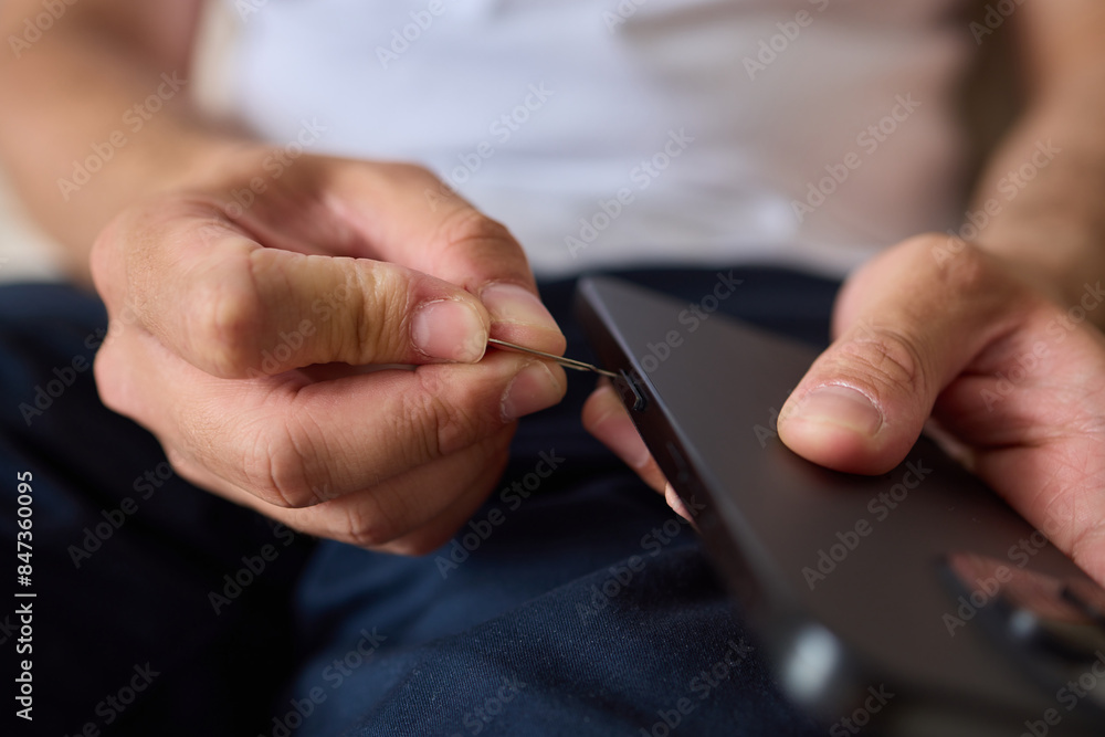 Guide on how to properly insert a SIM card into a smartphone using a ...