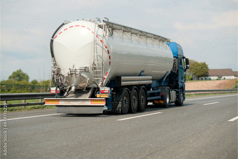 Petrol truck on highway hauling fossil oil refinery products. Fuel ...