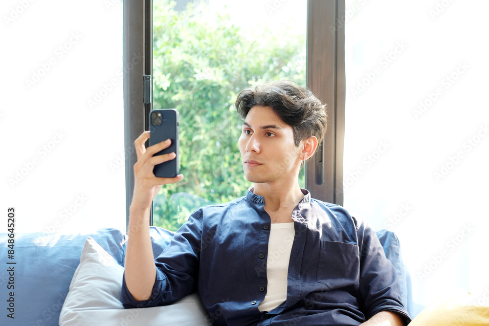 Foto de Young man scan his face for unlock his mobile phone, Face ...