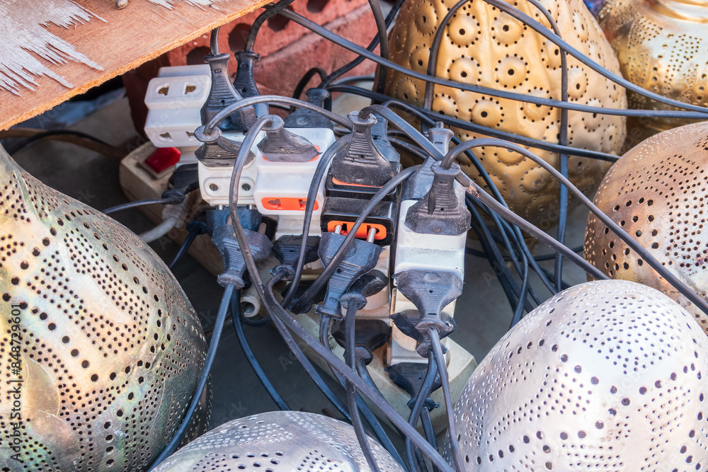 Old and damaged electric adapter power plug has many appliances are ...