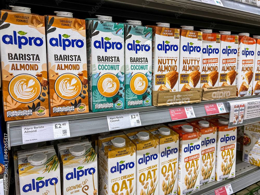 Alpro plant-based drinks displayed at the shelves of the supermarket ...