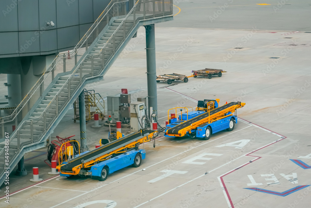 Equipment of a machine for loading and unloading luggage on an airplane ...