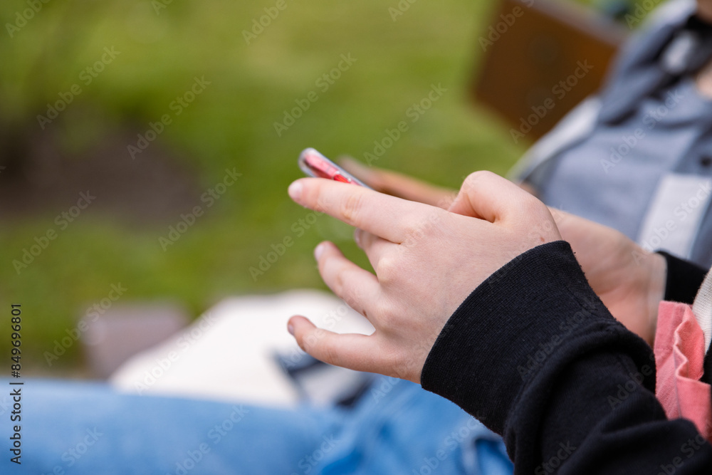 Thumb finger on screen of mobile phone. Person texting text message ...