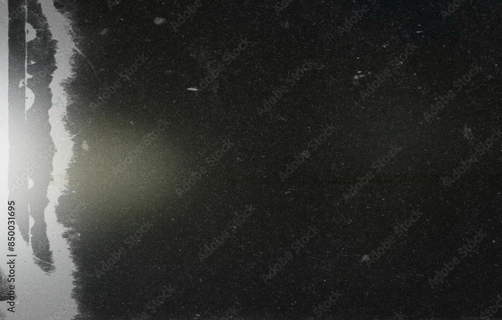 grainy colorful warm gray light leaks on black background with dust ...