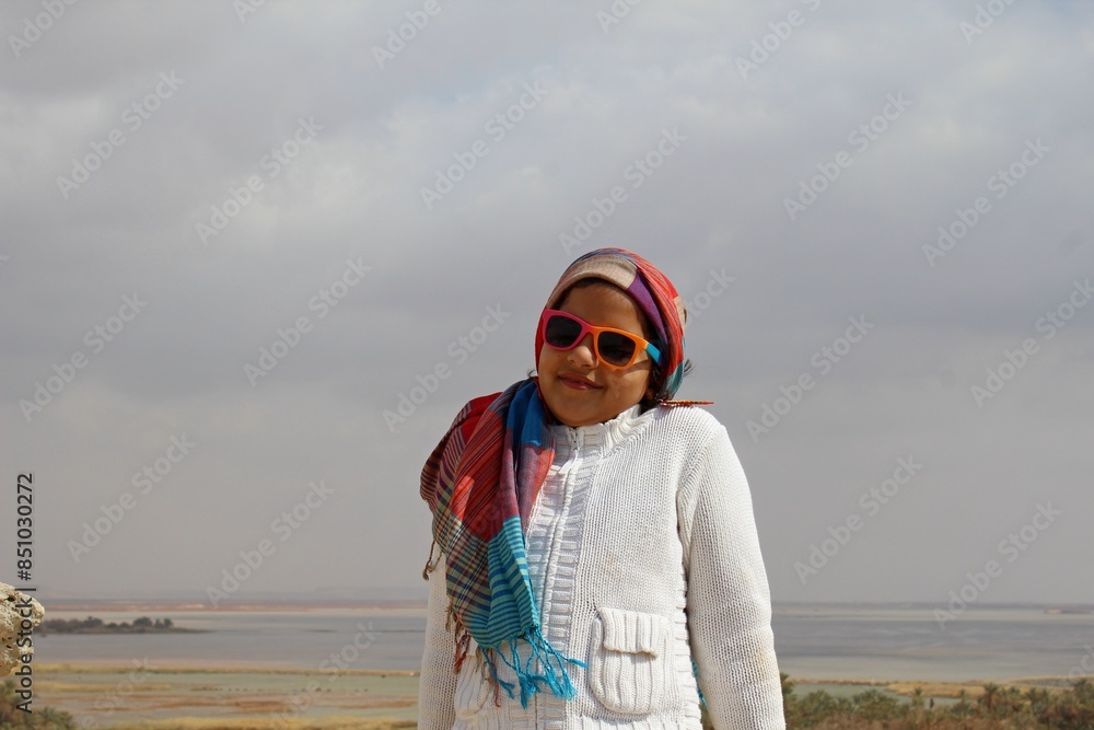 Beautiful young girl having fun on top of amoun temple of the oracle in ...