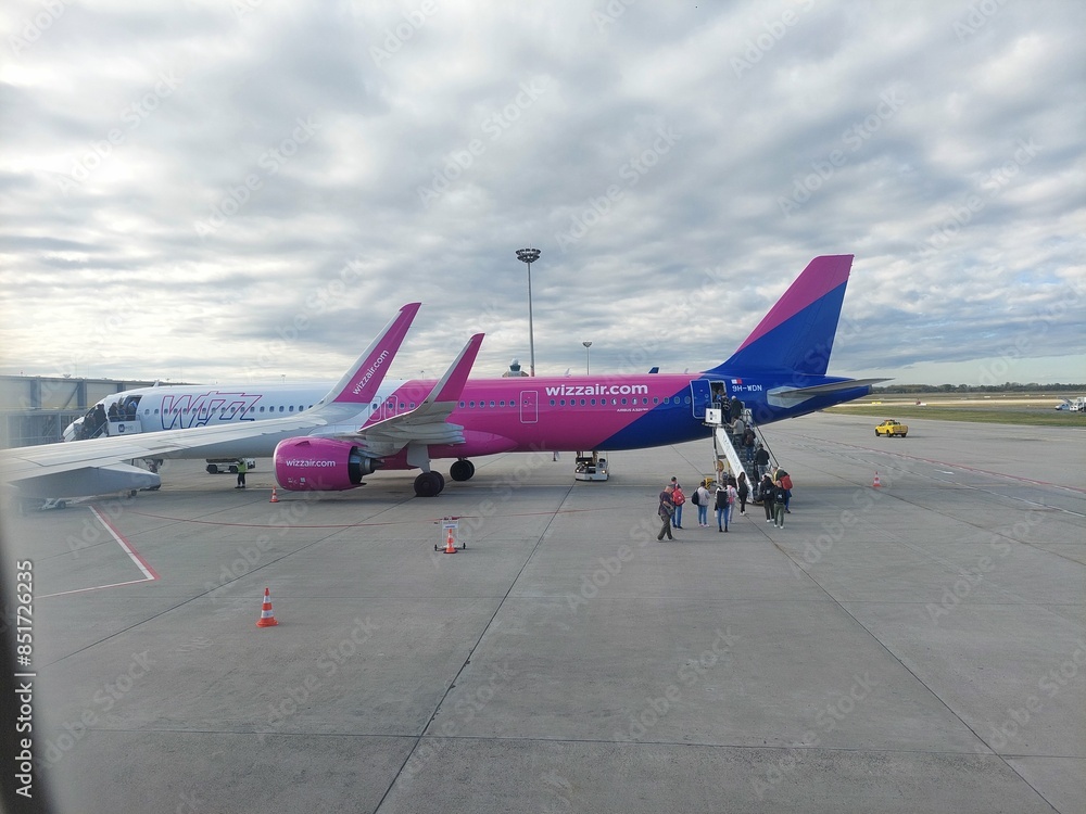 Passengers boarding a Wizz Air airplane at the airport Stock Photo ...