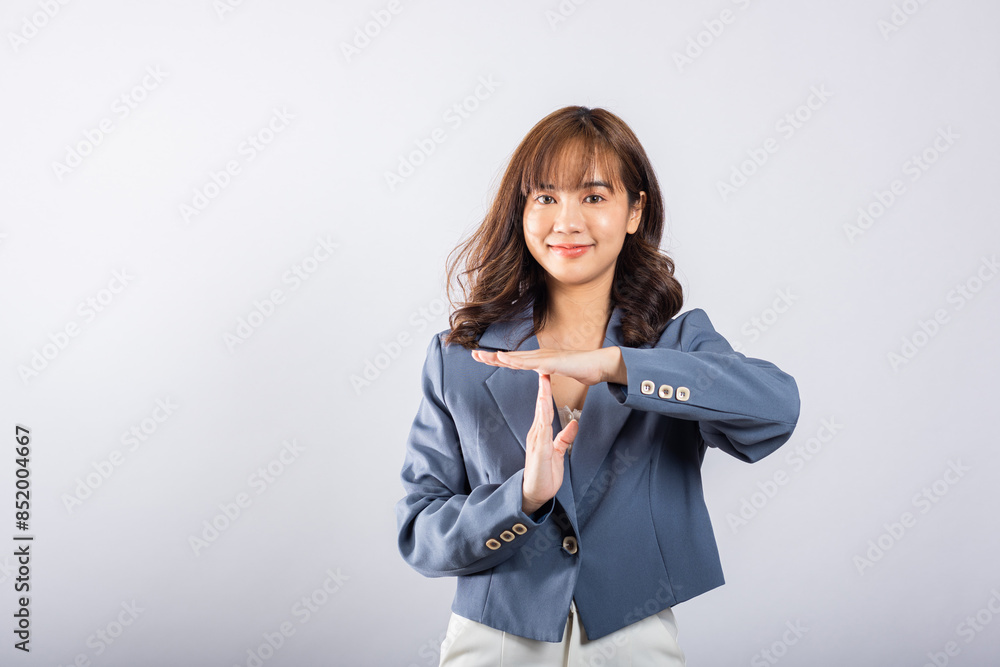 Closeup portrait young business woman wearing a suit smiling making ...