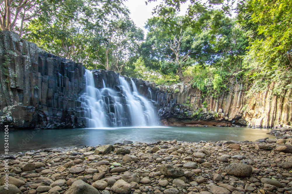 The waterfall is a 10 m high waterfall that cascades over basal steles ...