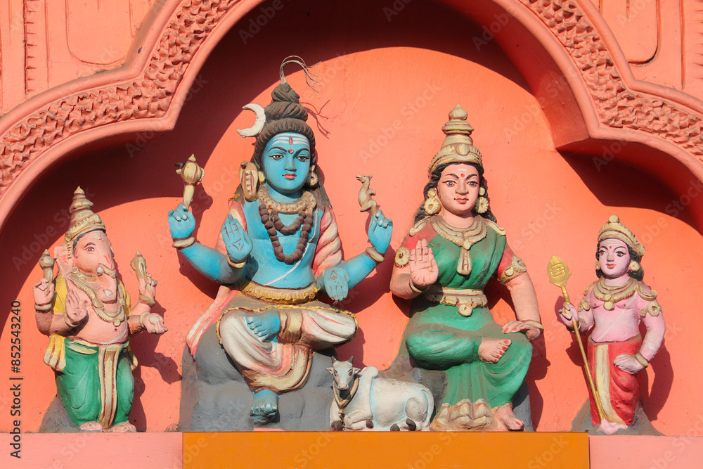 Shiva, Parvati, Ganesha and Subramanya - divine family on the wall of a ...