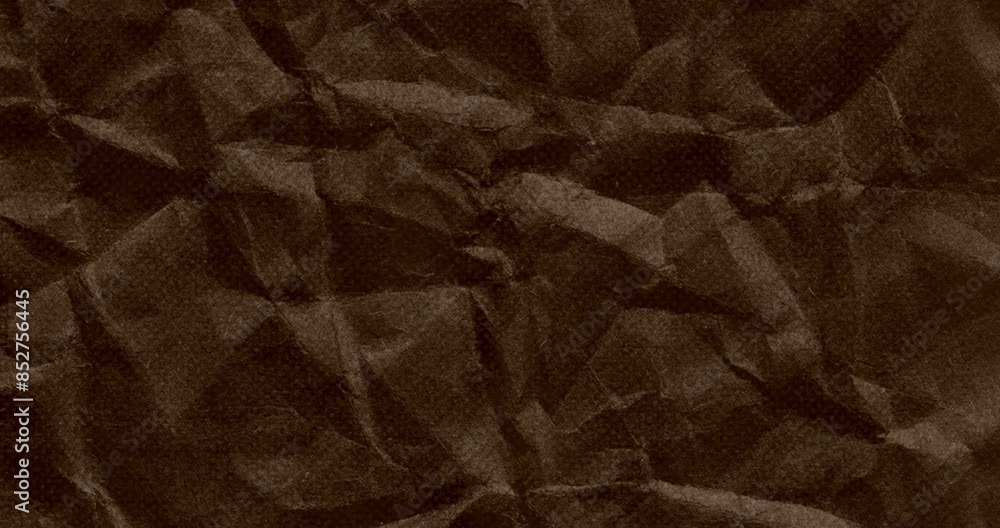 dark chocolate crumpled wrinkled sheet of paper. Stop motion animated ...