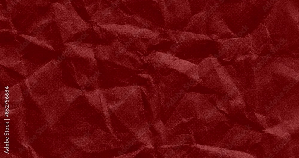 dark red crumpled wrinkled sheet of paper. Stop motion animated paper ...