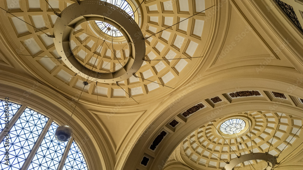 Elegant neoclassical architecture with ornate ceiling, spiraling modern ...