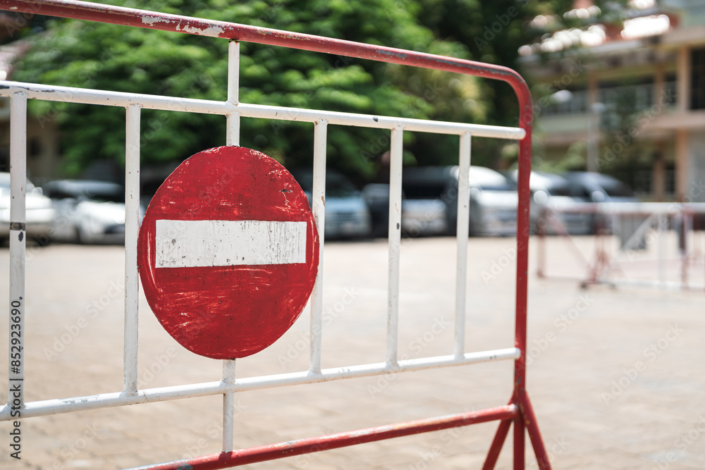 "Do not enter" or "One way" traffic road sign on road barrier fence ...