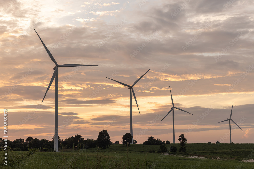 view of wind farm or wind park, with high wind turbines for generation ...