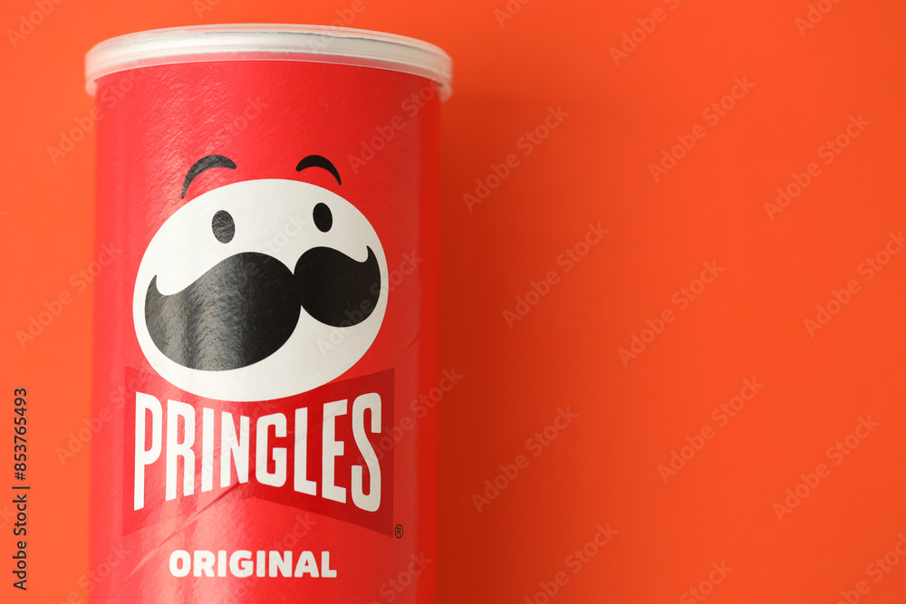KYIV, UKRAINE - APRIL 20, 2024 Pringles original potato chips on red ...