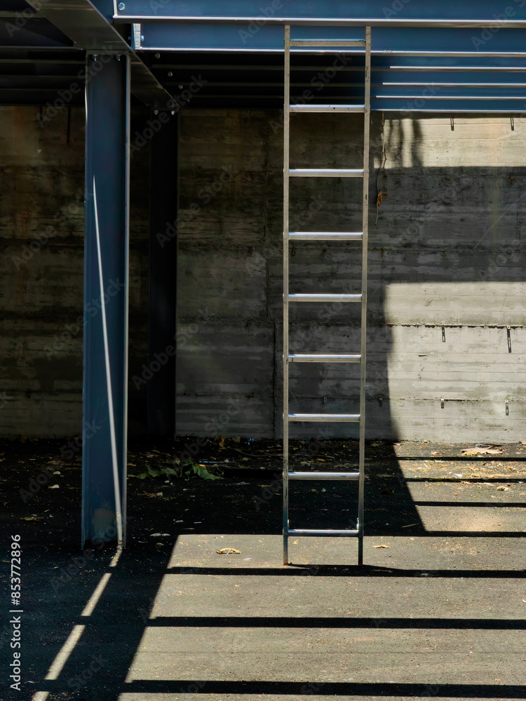 Interplay of Light and Shadow. Metal Ladders at Parking Spot Under ...