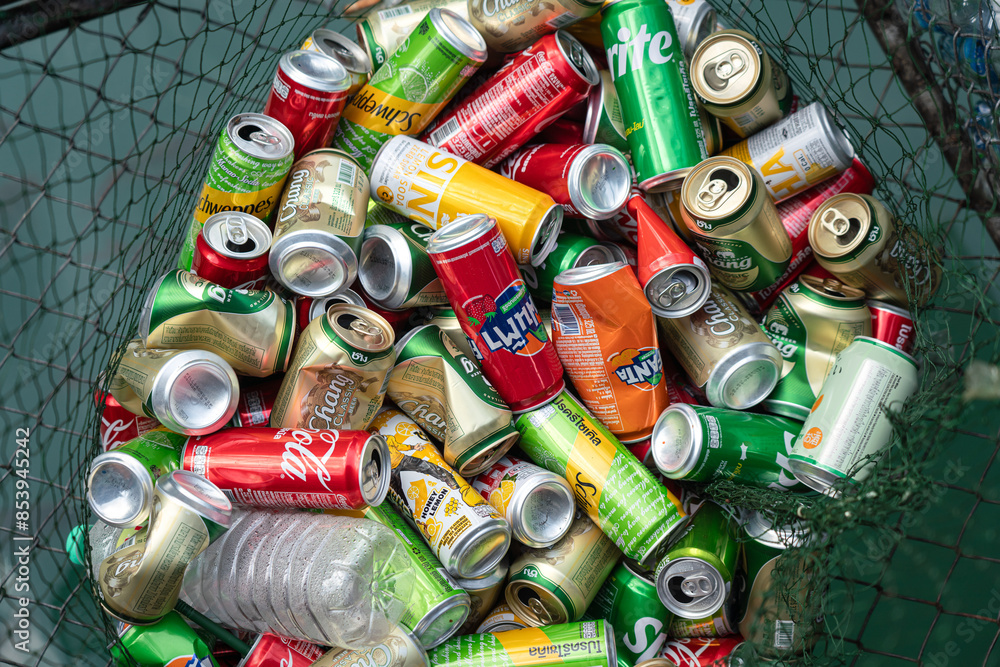 Bangkok, Thailand - 8 June 2024: Many soft drink tin cans are junked in ...