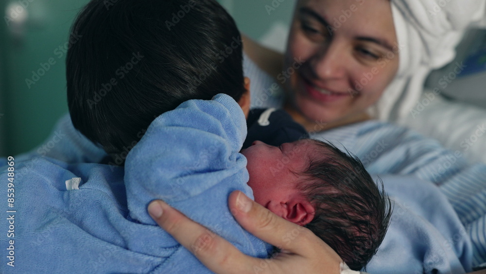 Family Welcoming Newborn at Hospital - Brother holding infant in arms ...