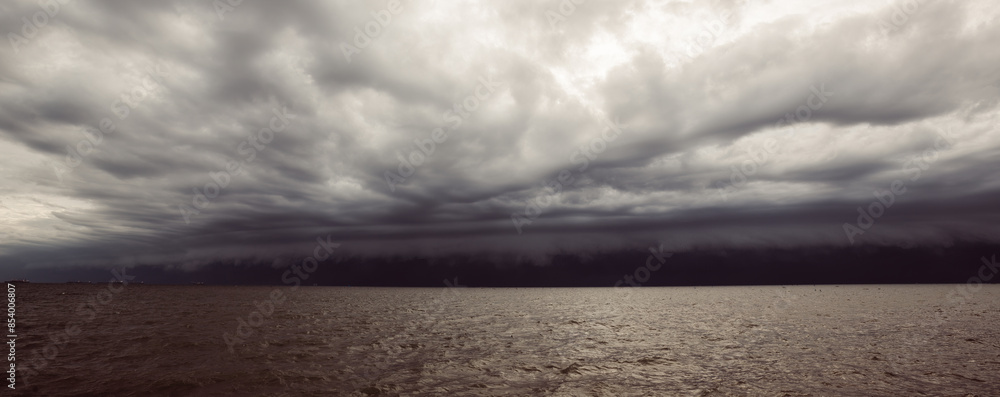 Cloudy storm in the sea before rainy.tornado storms cloud above the sea ...